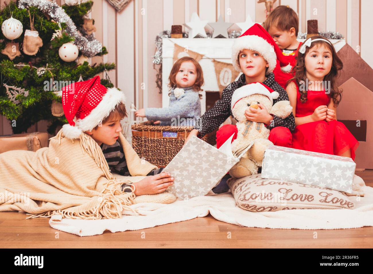 Two boys wearing Santa caps Stock Photo - Alamy