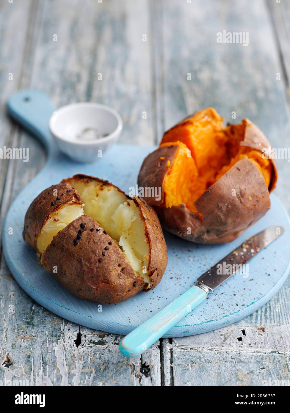 Two jacket potatoes Stock Photo - Alamy