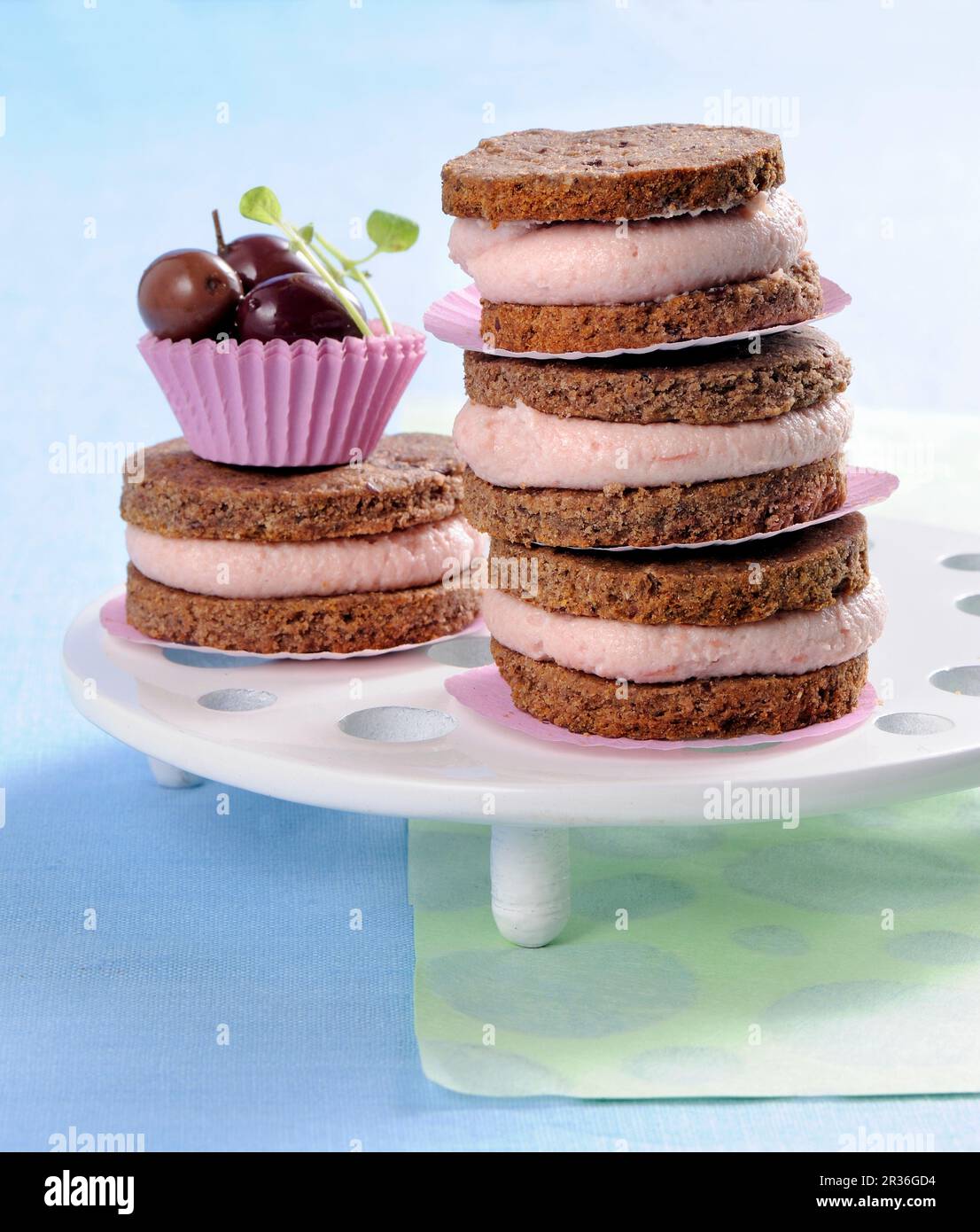 Olive sandwich biscuits with a spicy red wine cream Stock Photo - Alamy
