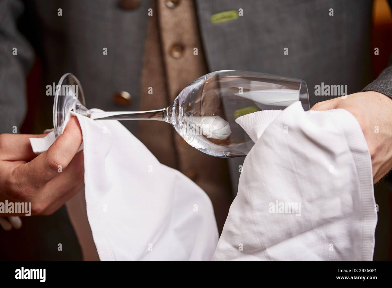 Waiter cleaning wine glass cloth hi-res stock photography and images ...