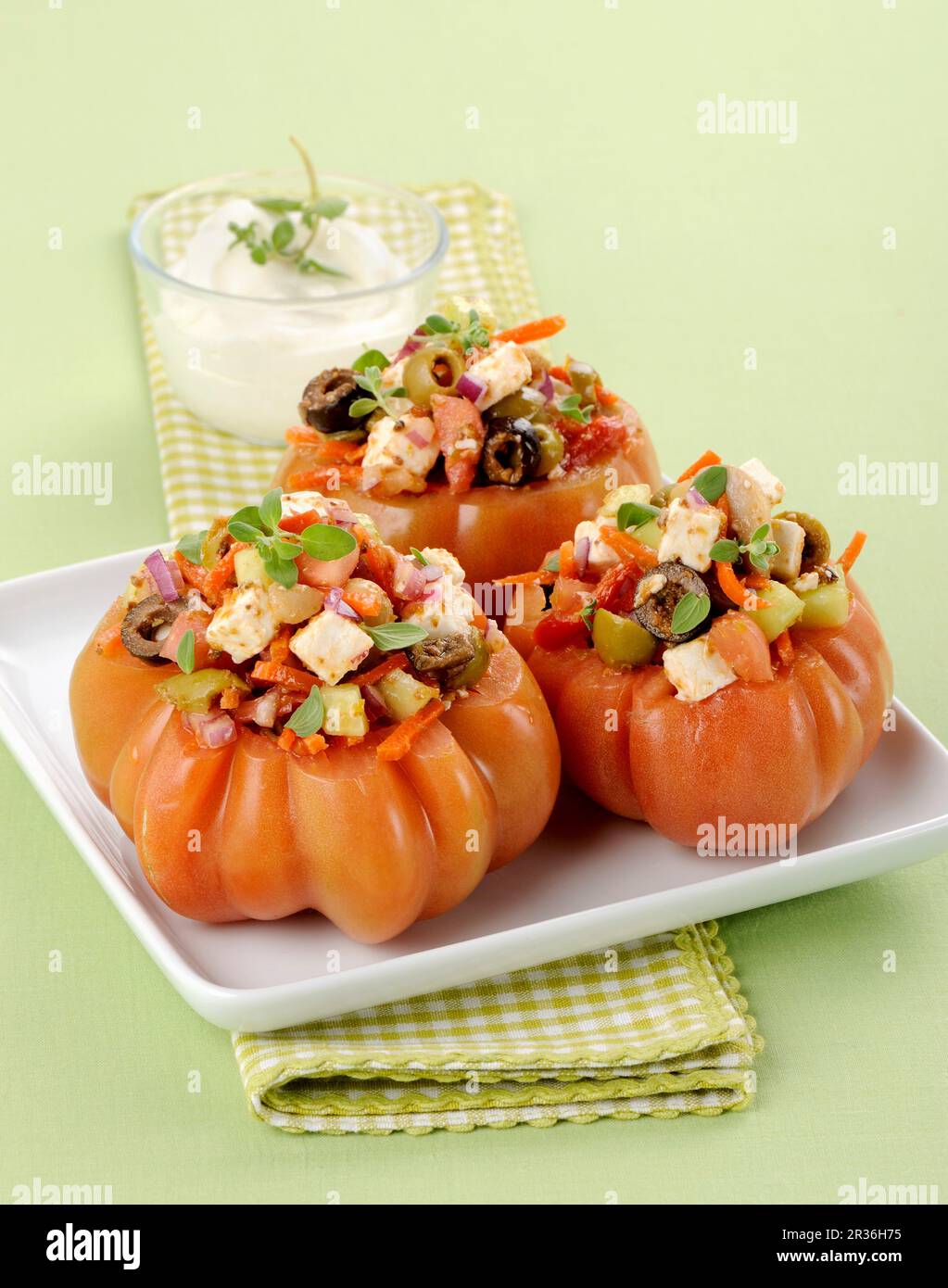 Beefsteak tomatoes filled with mozzarella salad Stock Photo - Alamy