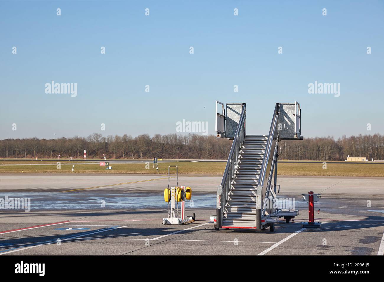Airplane ground handling stairs standing unused, empty Stock Photo - Alamy