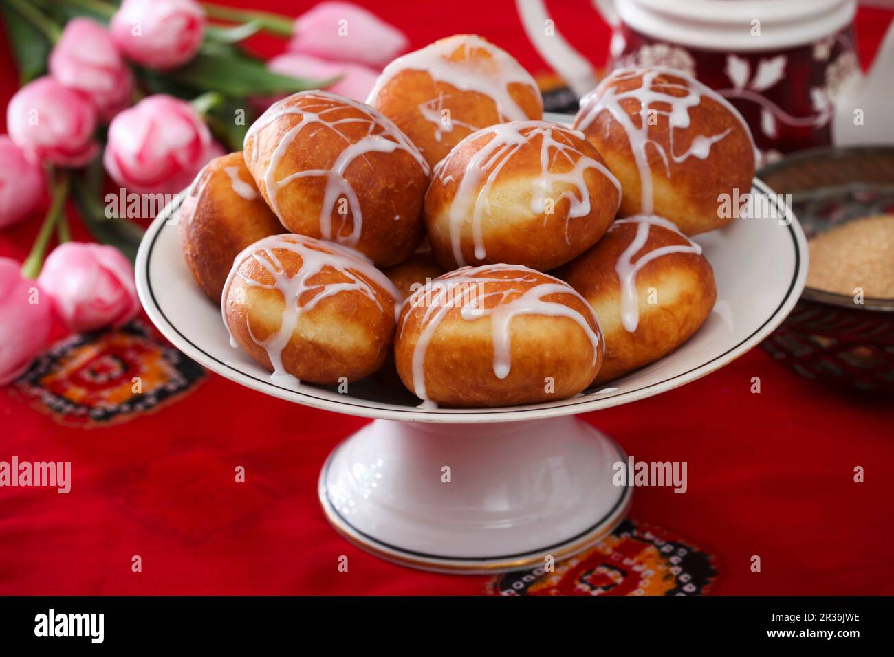 Mini doughnuts with white icing Stock Photo - Alamy