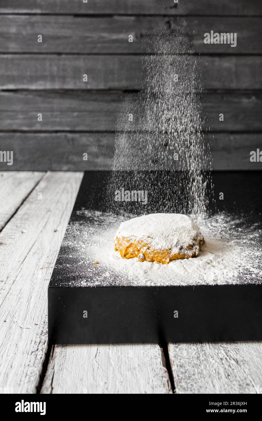 A gluten-free, vegan burger patty being dusted with flour Stock Photo ...