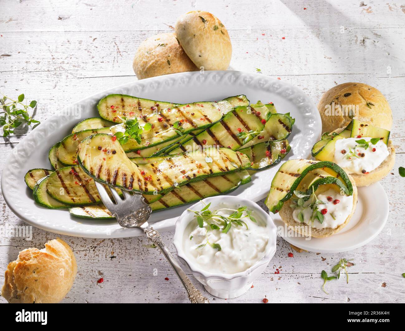 Marinated grilled courgettes with a sheep's cheese sauce and bread ...
