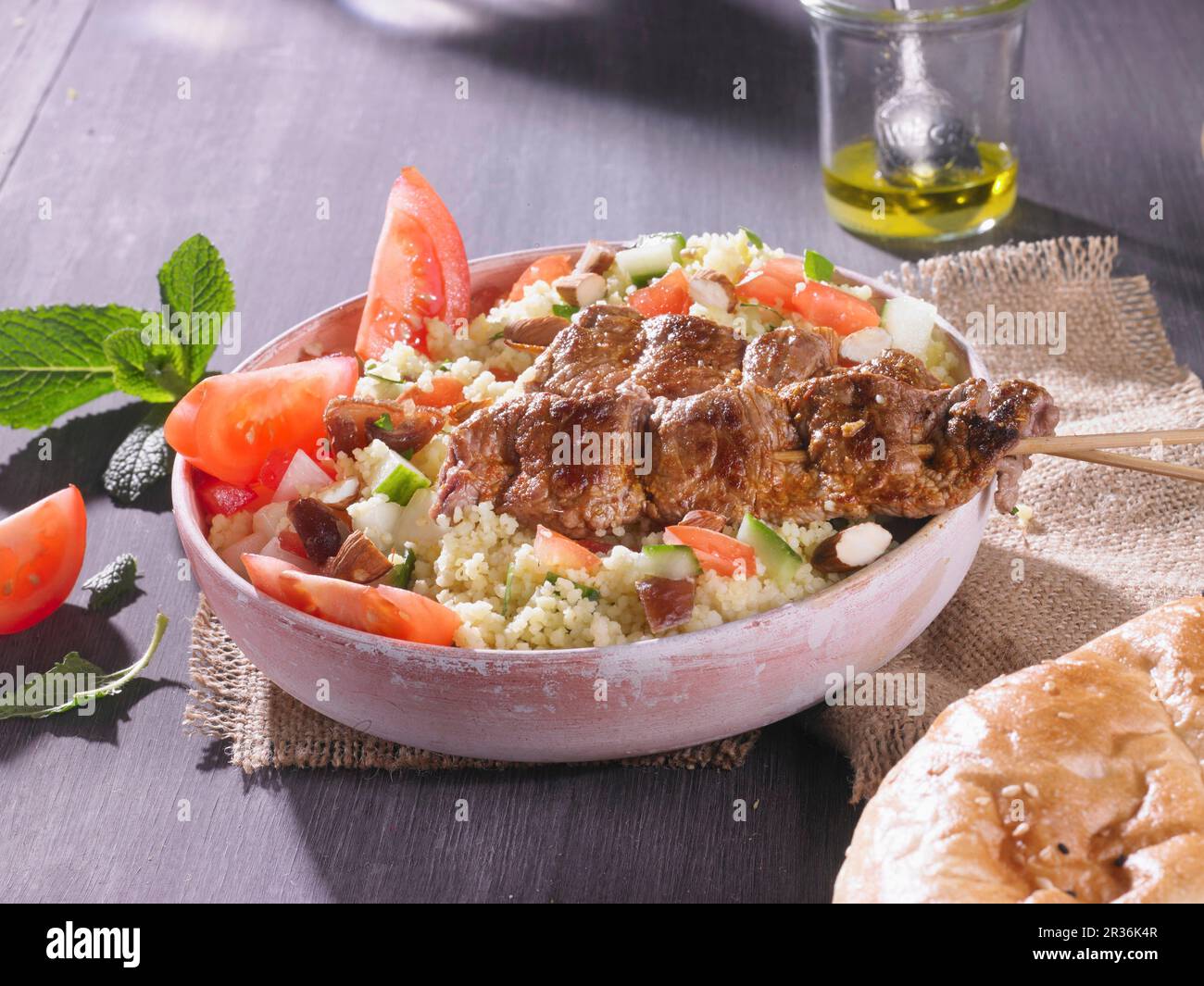 Couscous tabbouleh with meat kebabs and pitta bread Stock Photo - Alamy