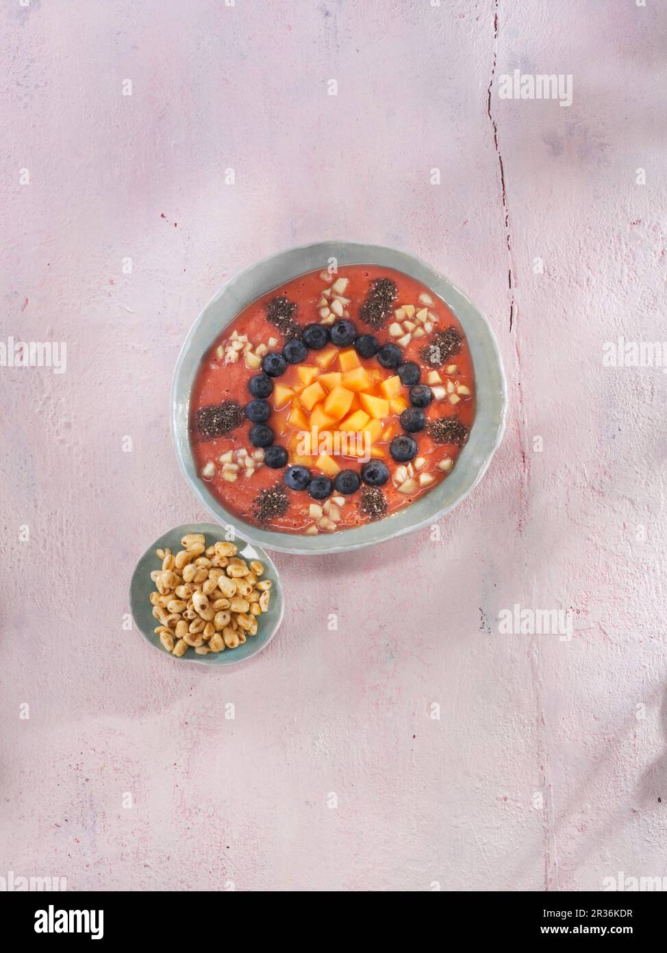 Melon and raspberry smoothie bowl Stock Photo - Alamy
