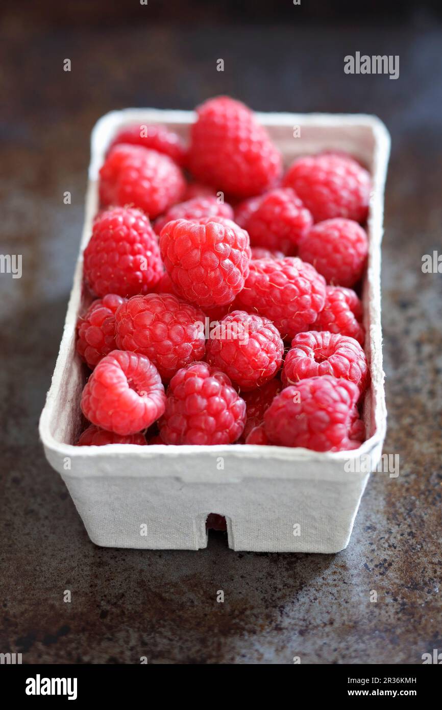 Fresh raspberries in a paper punnet Stock Photo - Alamy