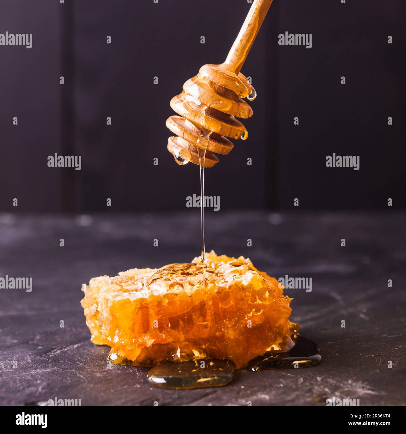 Honey drip and comb Stock Photo - Alamy