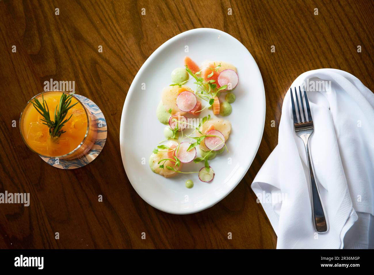 Pickled rhubarb, basil foam and radish on scallop slices Stock Photo ...