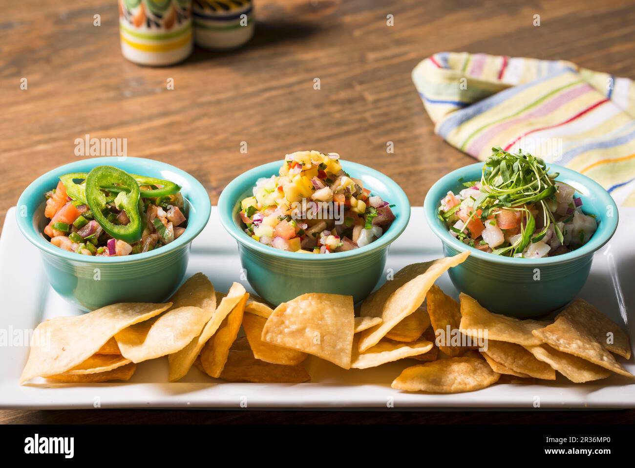 Three different salsas with tortilla chips Stock Photo - Alamy