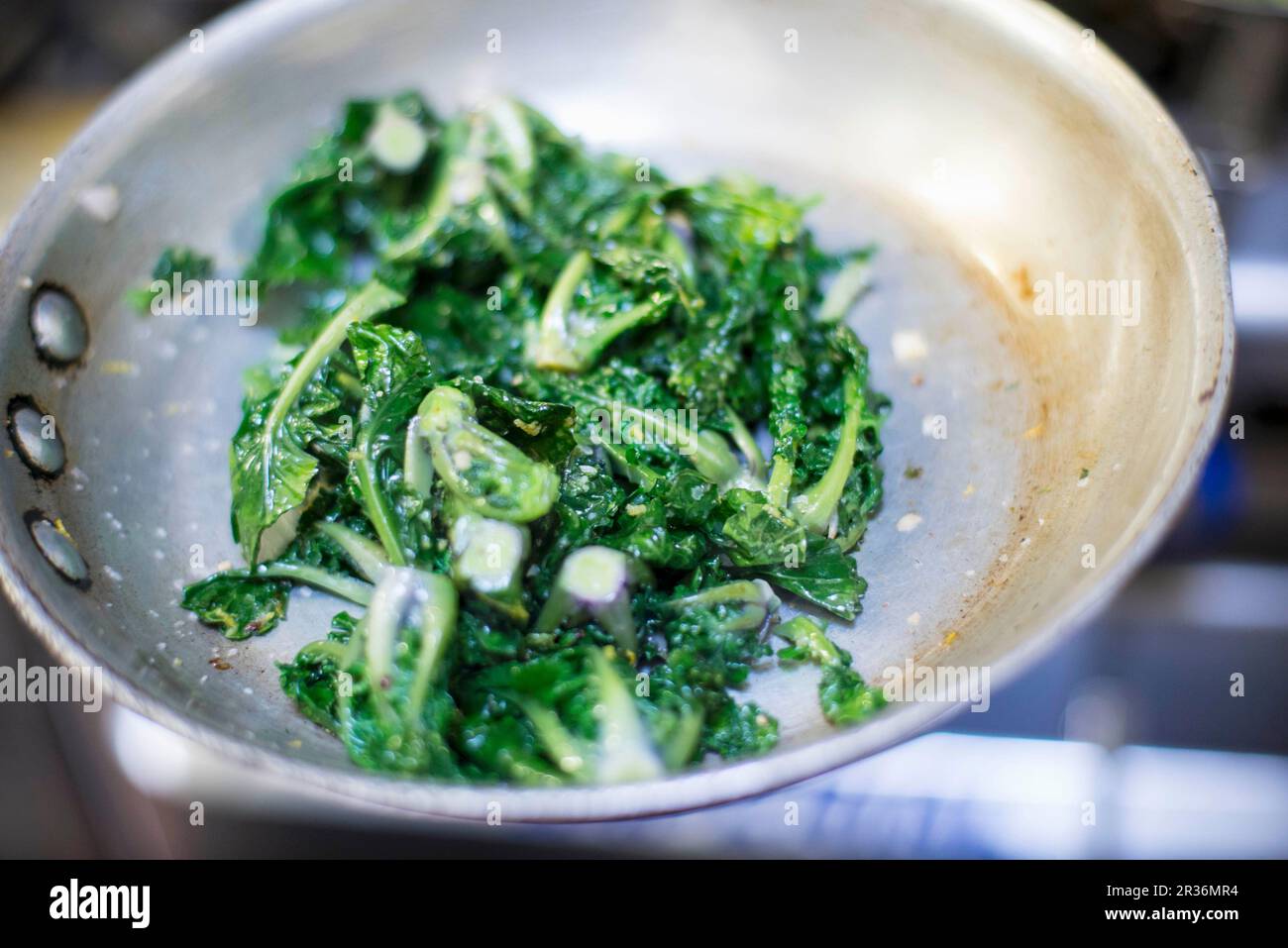 Leaf vegetables in a frying pan Stock Photo - Alamy