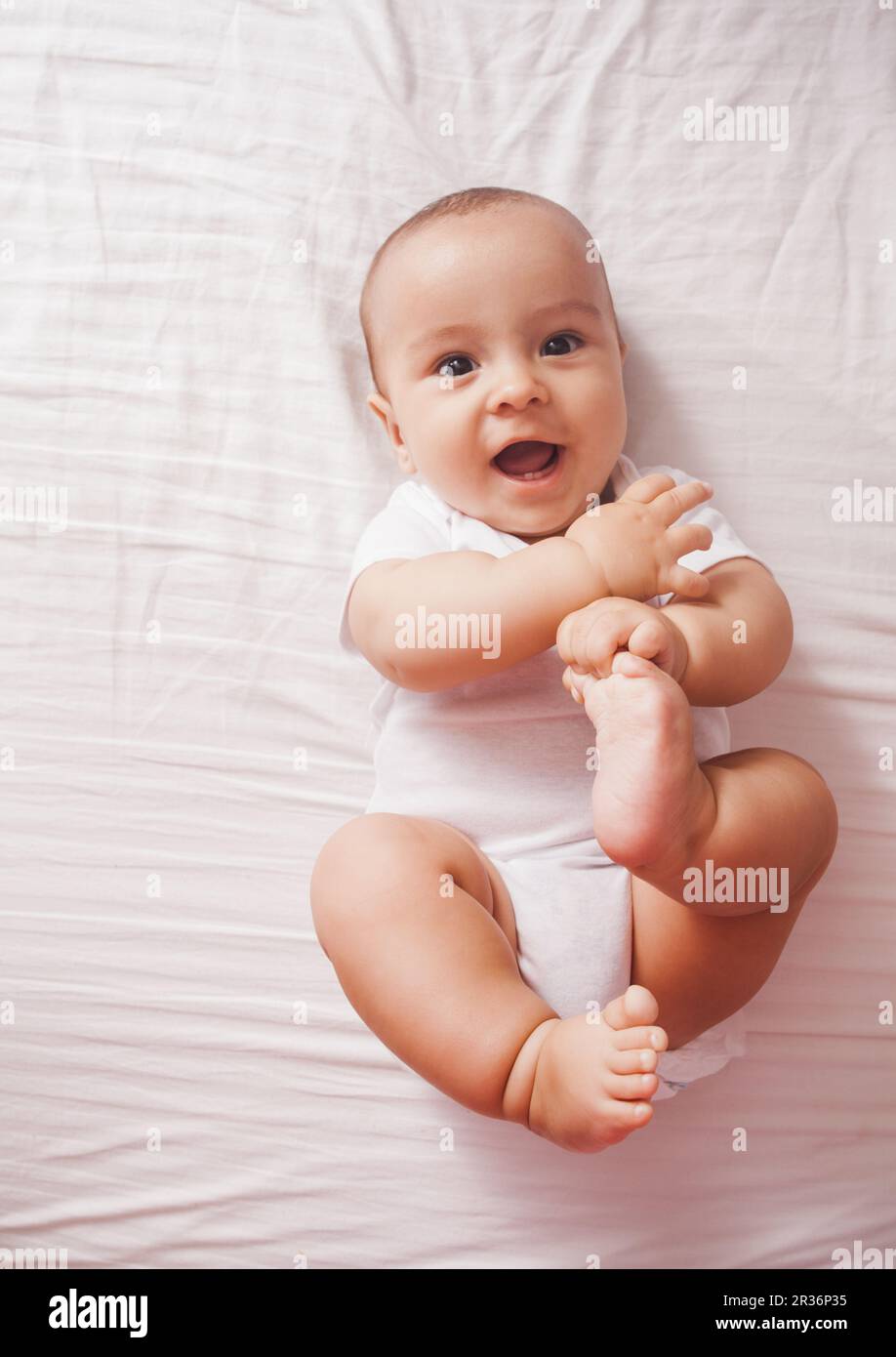 Adorable little baby lying hi-res stock photography and images - Alamy