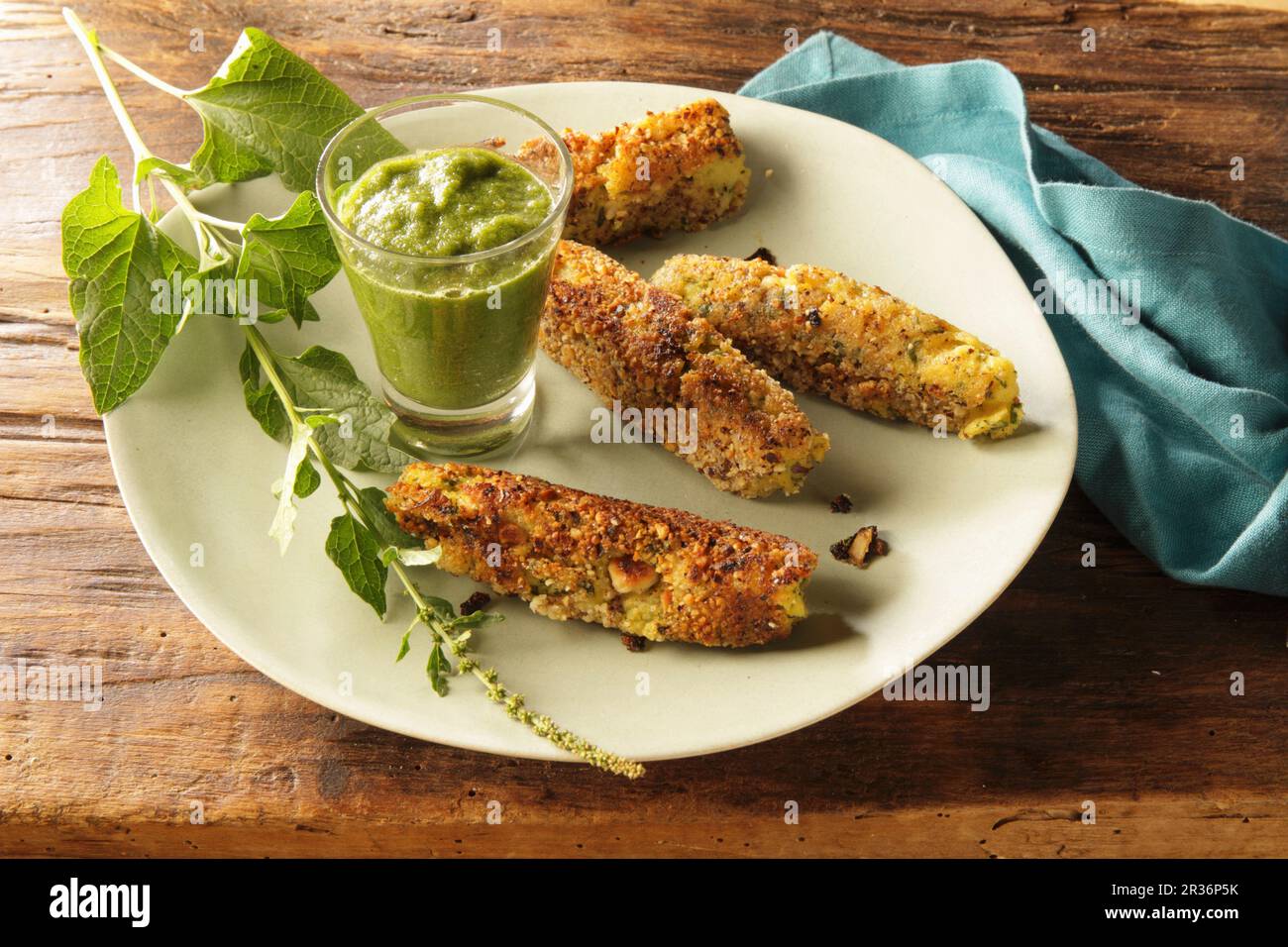 Polenta sticks with hazelnuta and a dip Stock Photo - Alamy
