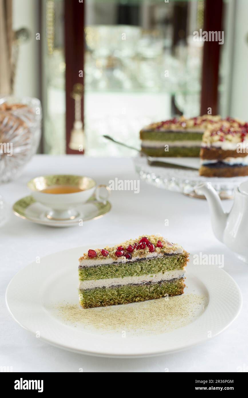 Spinach and pistachio sponge cake with pomegranate seeds and berry ...