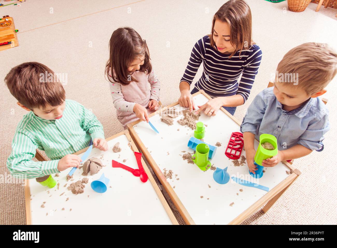Children play with kinetic sand Stock Photo - Alamy