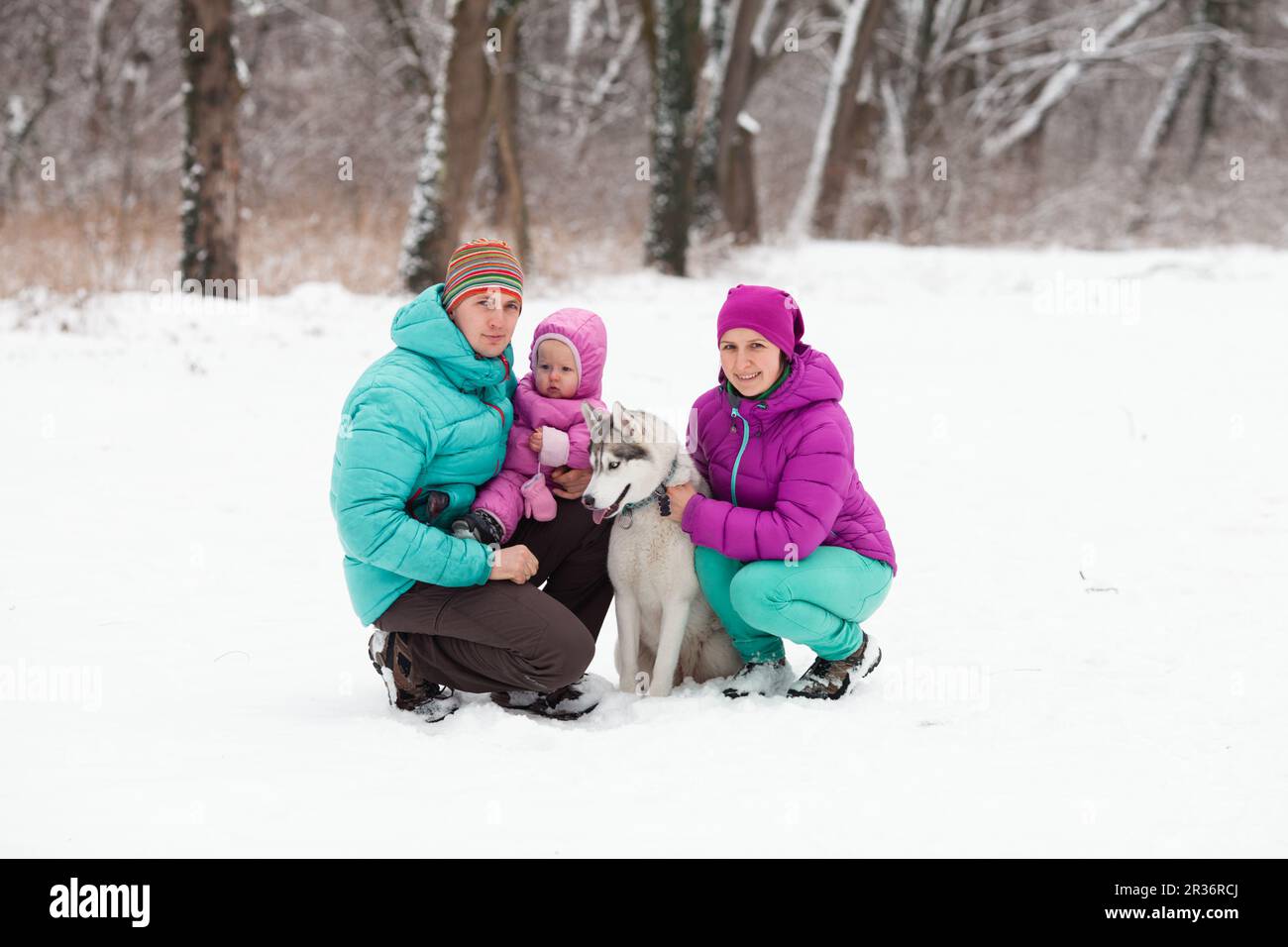 Happy family with puppy hi-res stock photography and images - Alamy
