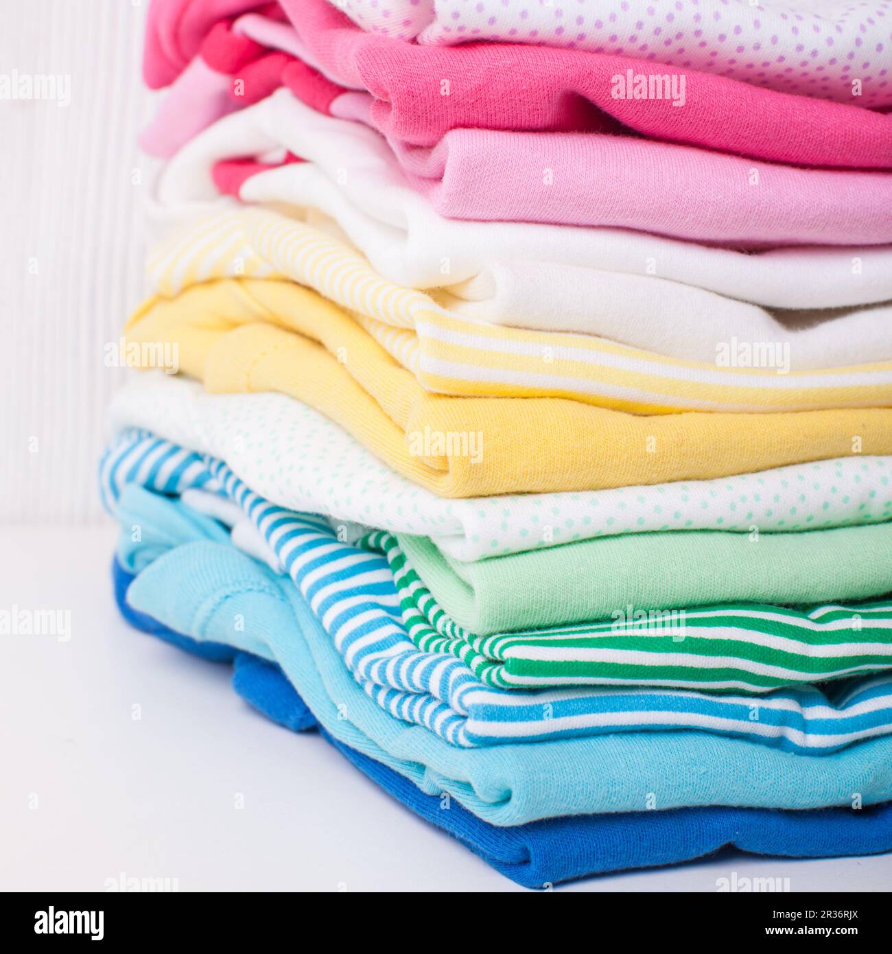 Folded baby clothes Stock Photo - Alamy