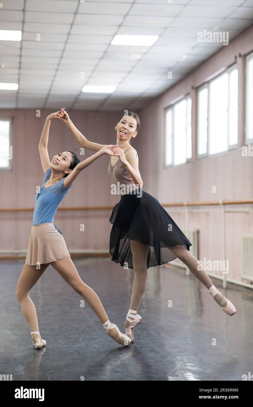 Two Asian ballerinas are dancing in the class Stock Photo - Alamy