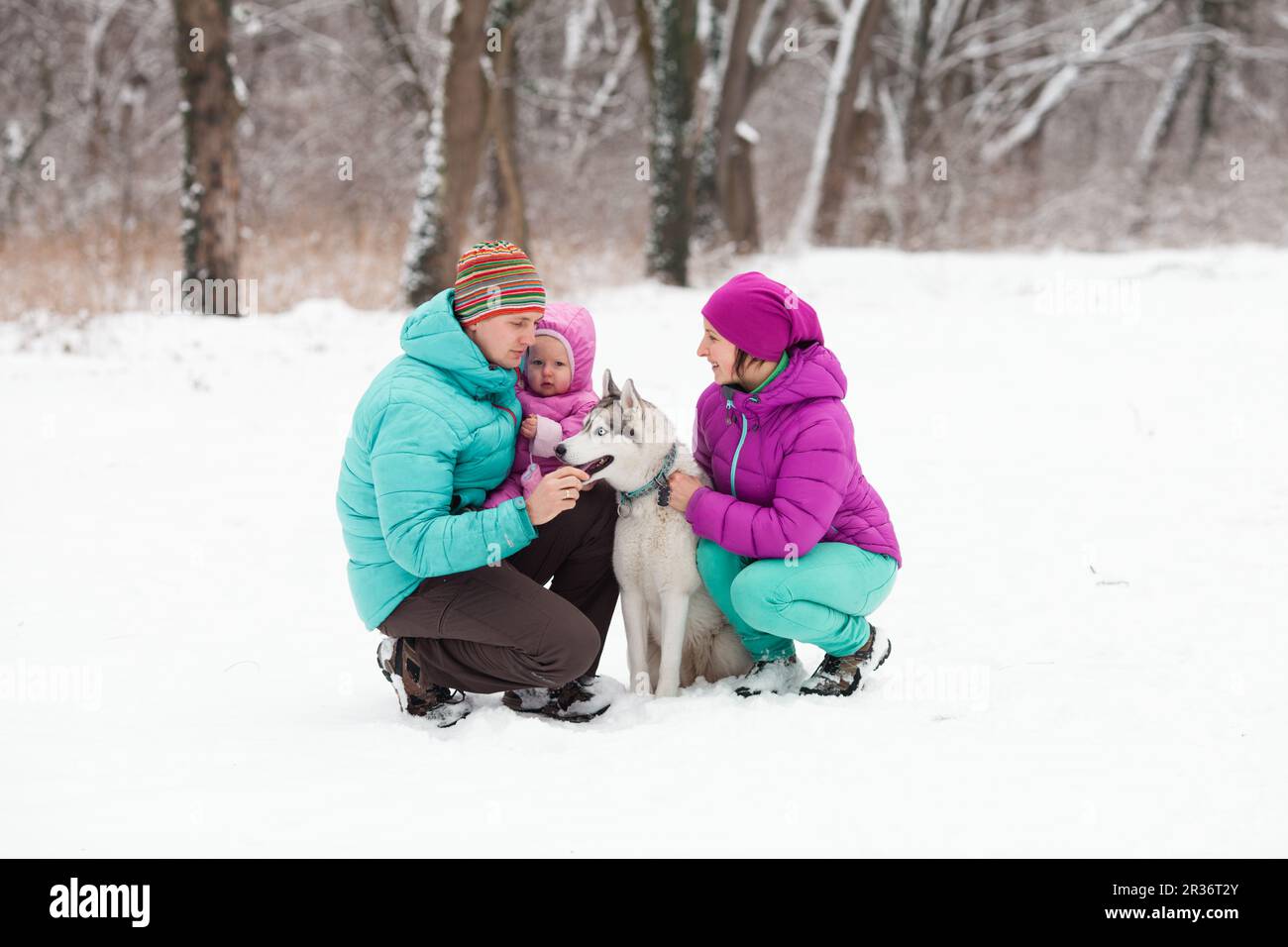 Happy family with puppy hi-res stock photography and images - Alamy