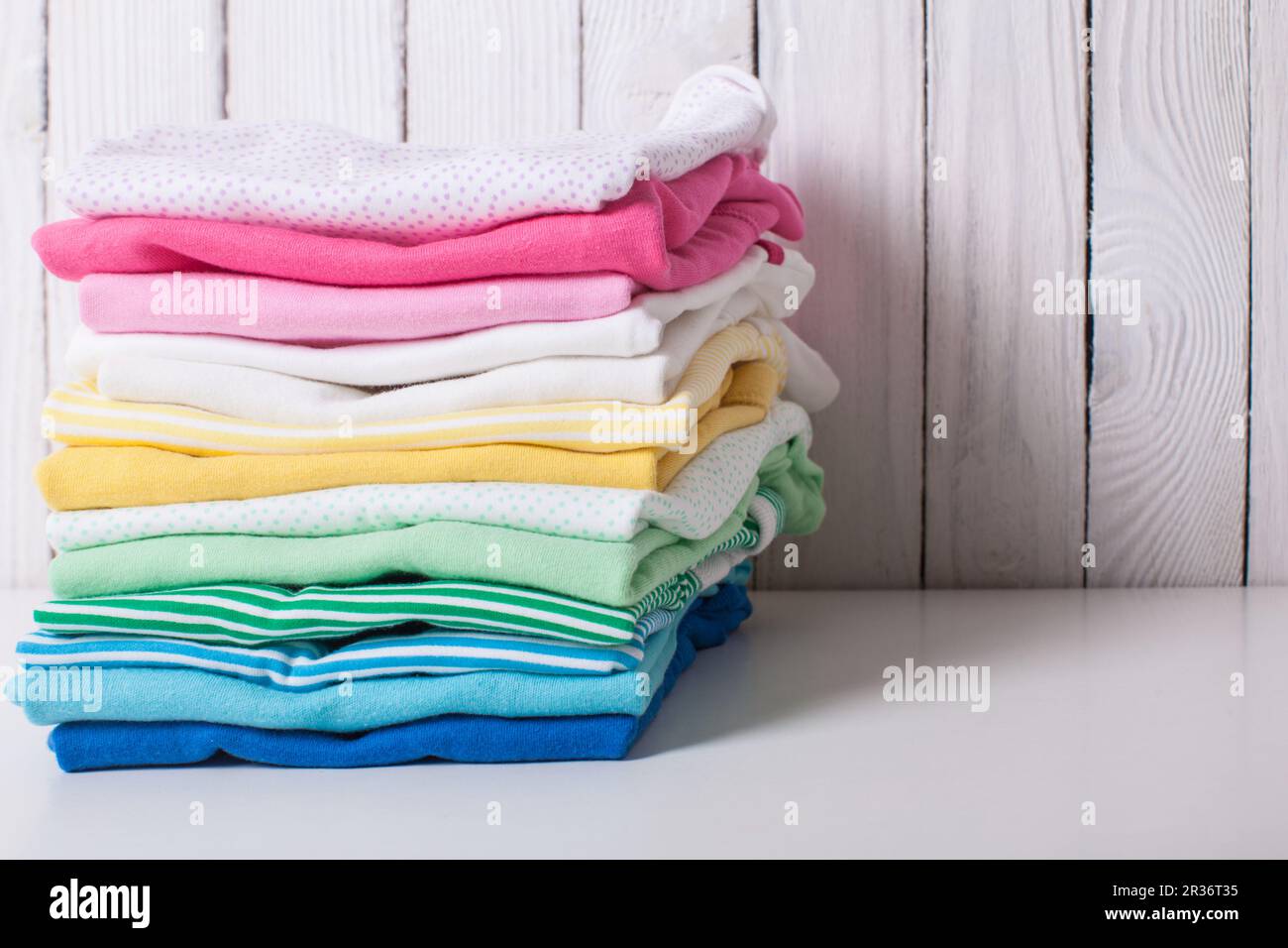 Folded baby clothes Stock Photo - Alamy