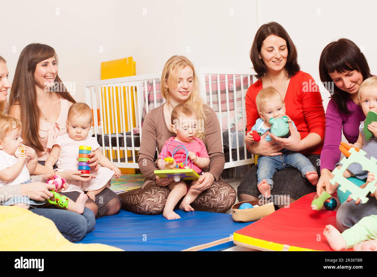 Group of mothers with their babies Stock Photo - Alamy