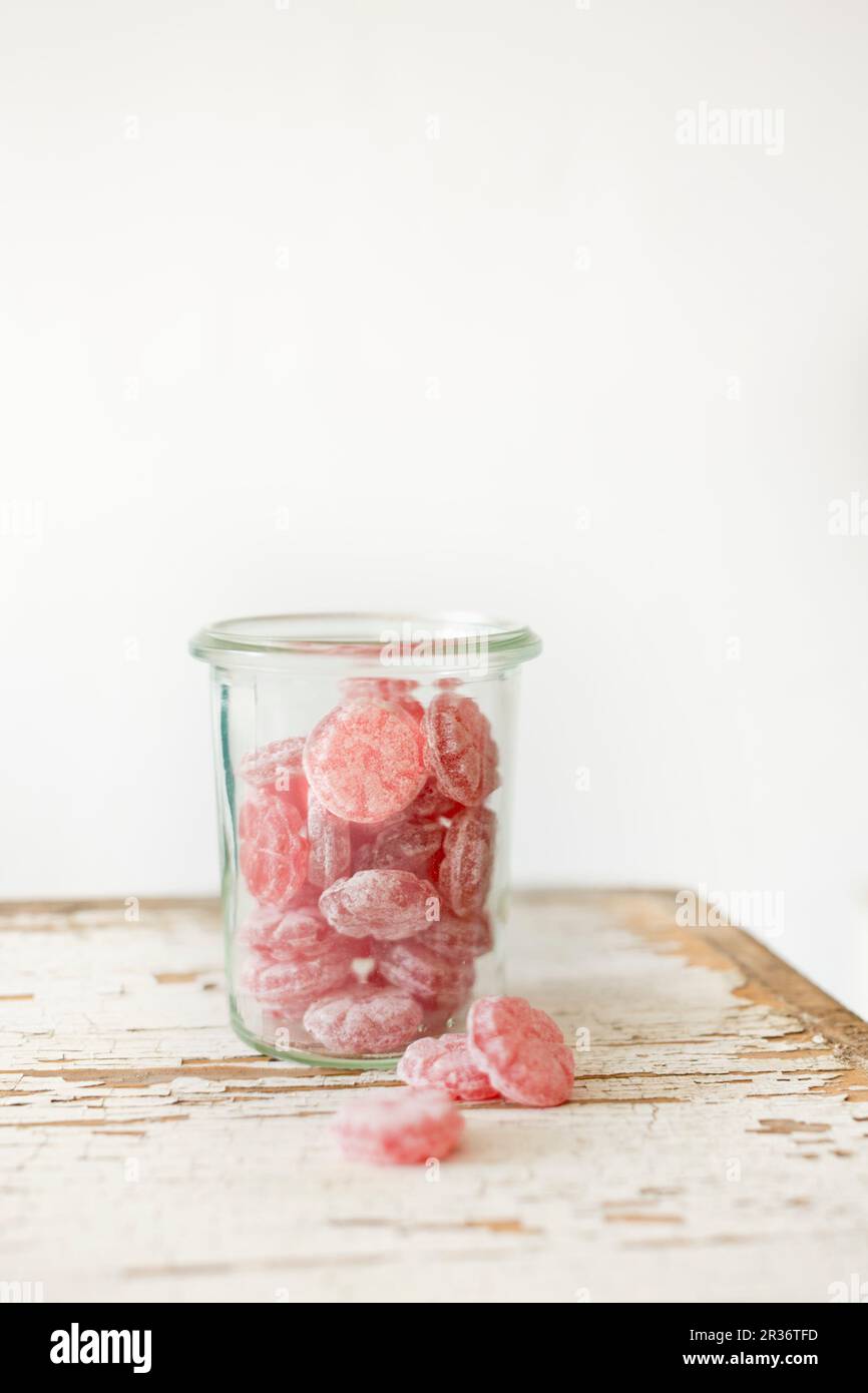 A glass jar filled with boiled sweets (French poppy sweets Stock Photo ...