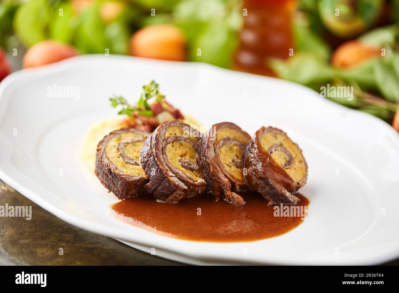 A beef roulade with an apricot & polenta filling Stock Photo - Alamy