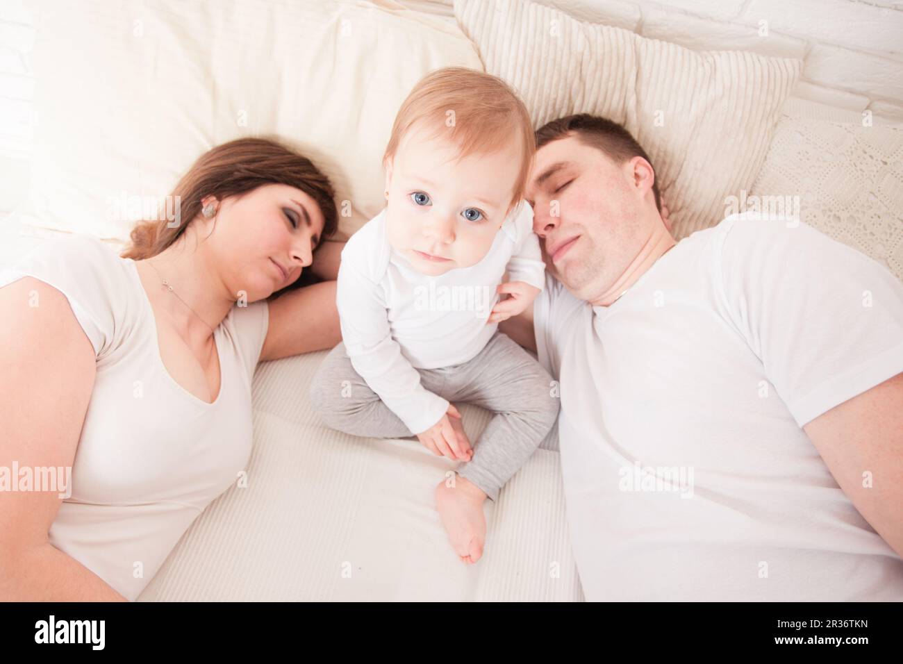 Tired and sleepy parents Stock Photo - Alamy