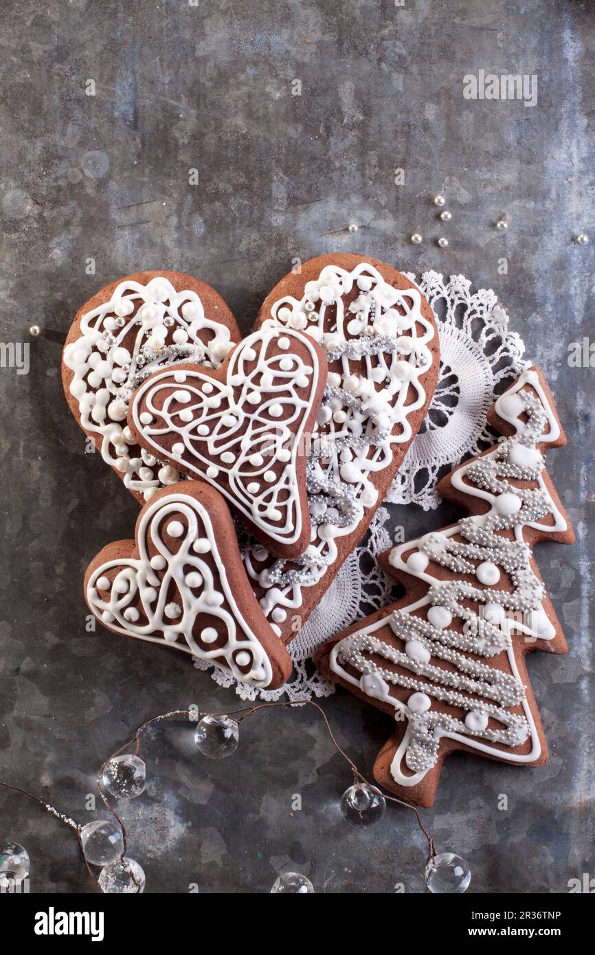 Christmas gingerbread Christmas tree and heart biscuits on a lace doily ...