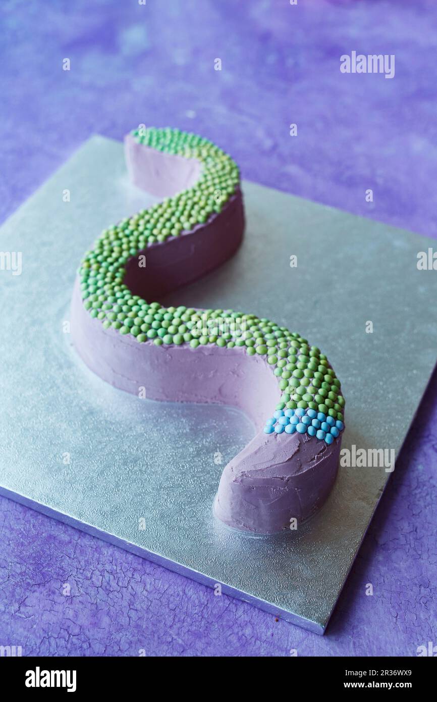 A snake cake for a children's party Stock Photo - Alamy
