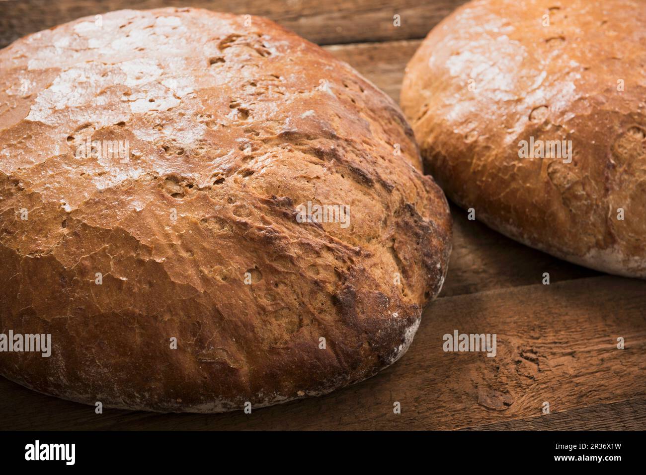 Two round loaves of crusty bread Stock Photo - Alamy
