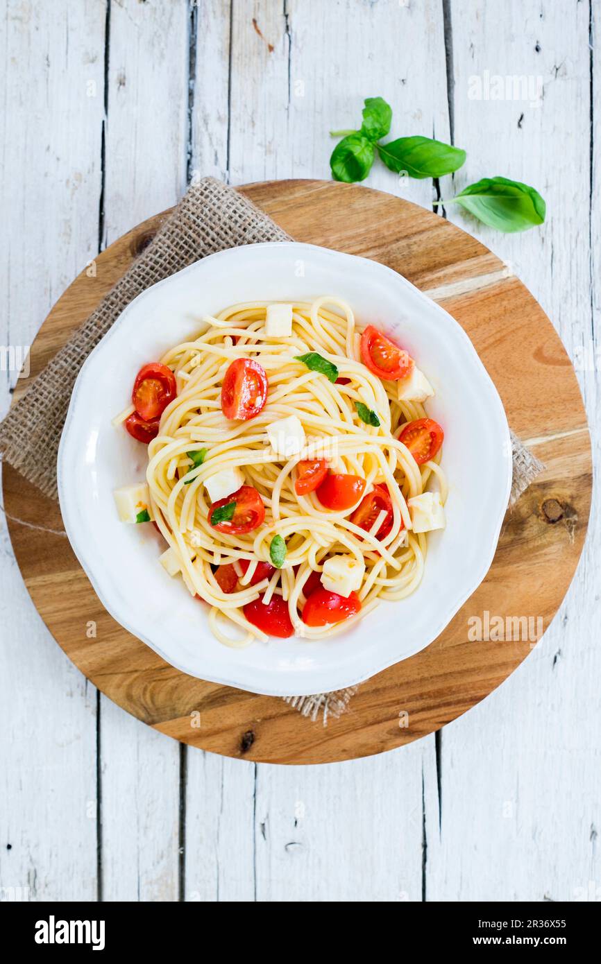 Italian pasta alla checca with raw tomatoes Stock Photo - Alamy