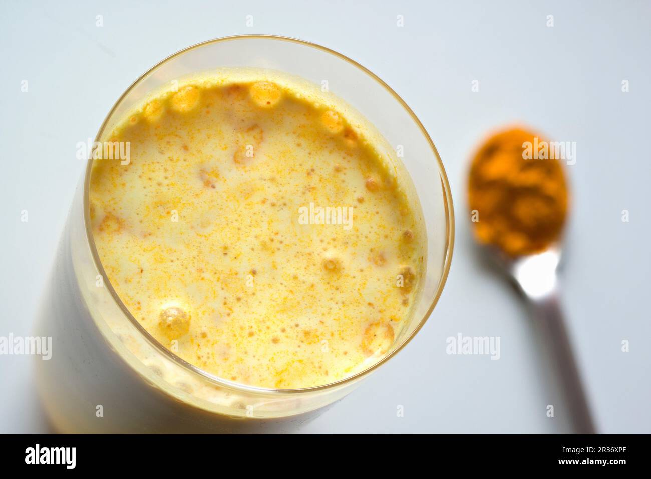 Golden milk: a milk drink with almond milk and turmeric in a glass ...
