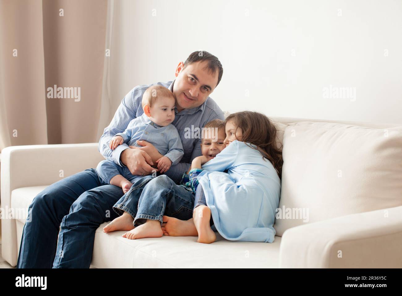 Father and three children Stock Photo - Alamy
