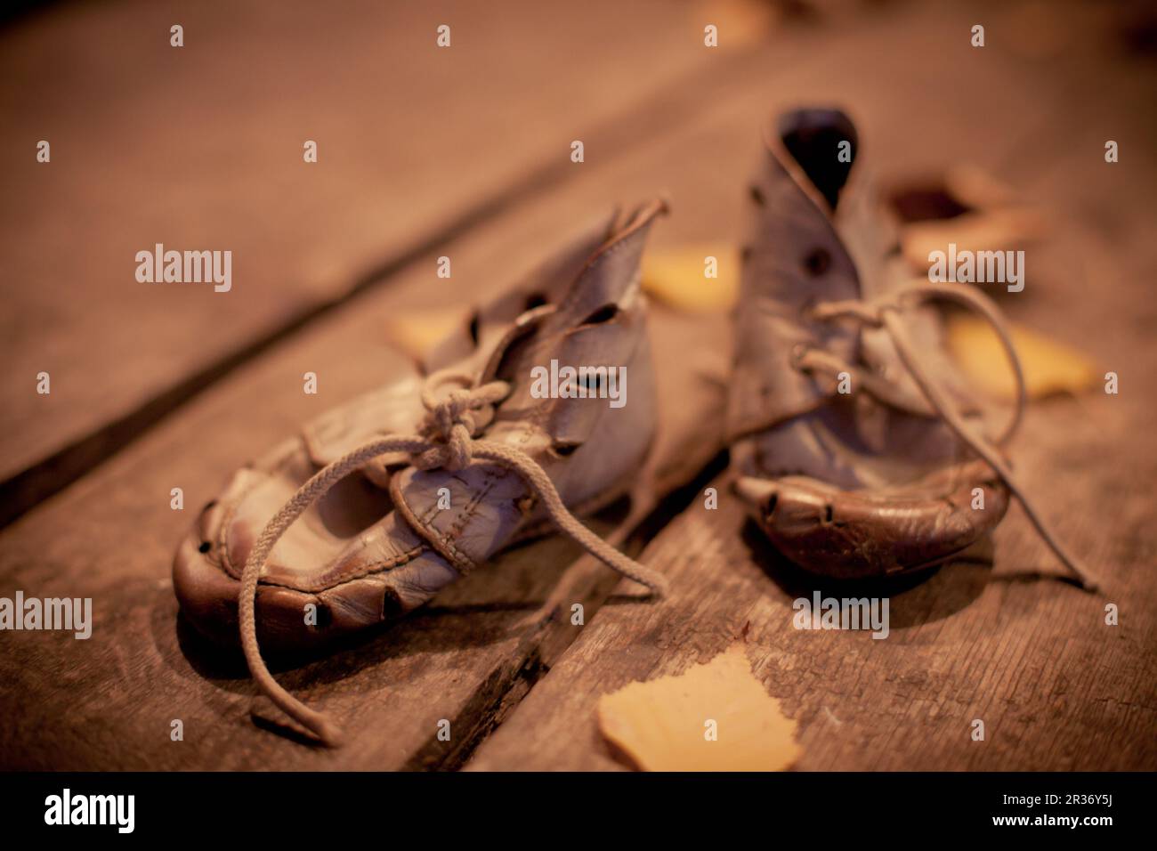 Old shoes for poor child Stock Photo - Alamy