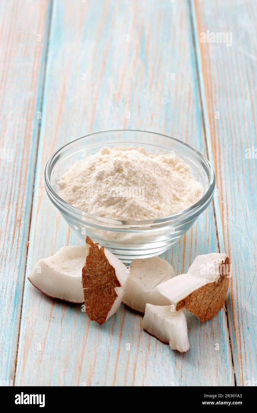 Coconut flour and chunks of coconut Stock Photo - Alamy