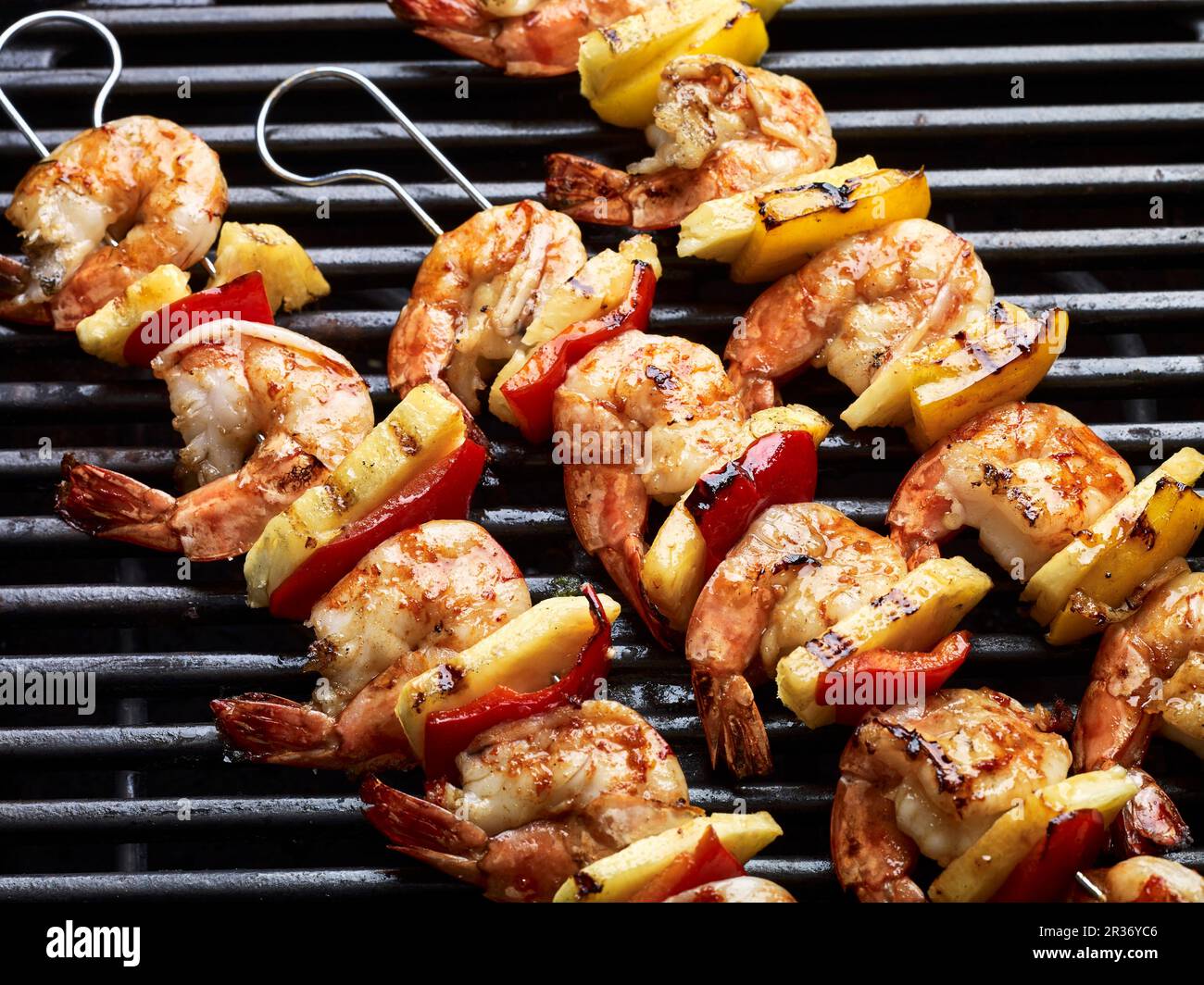 Prawn and vegetable kebabs on the barbecue Stock Photo - Alamy