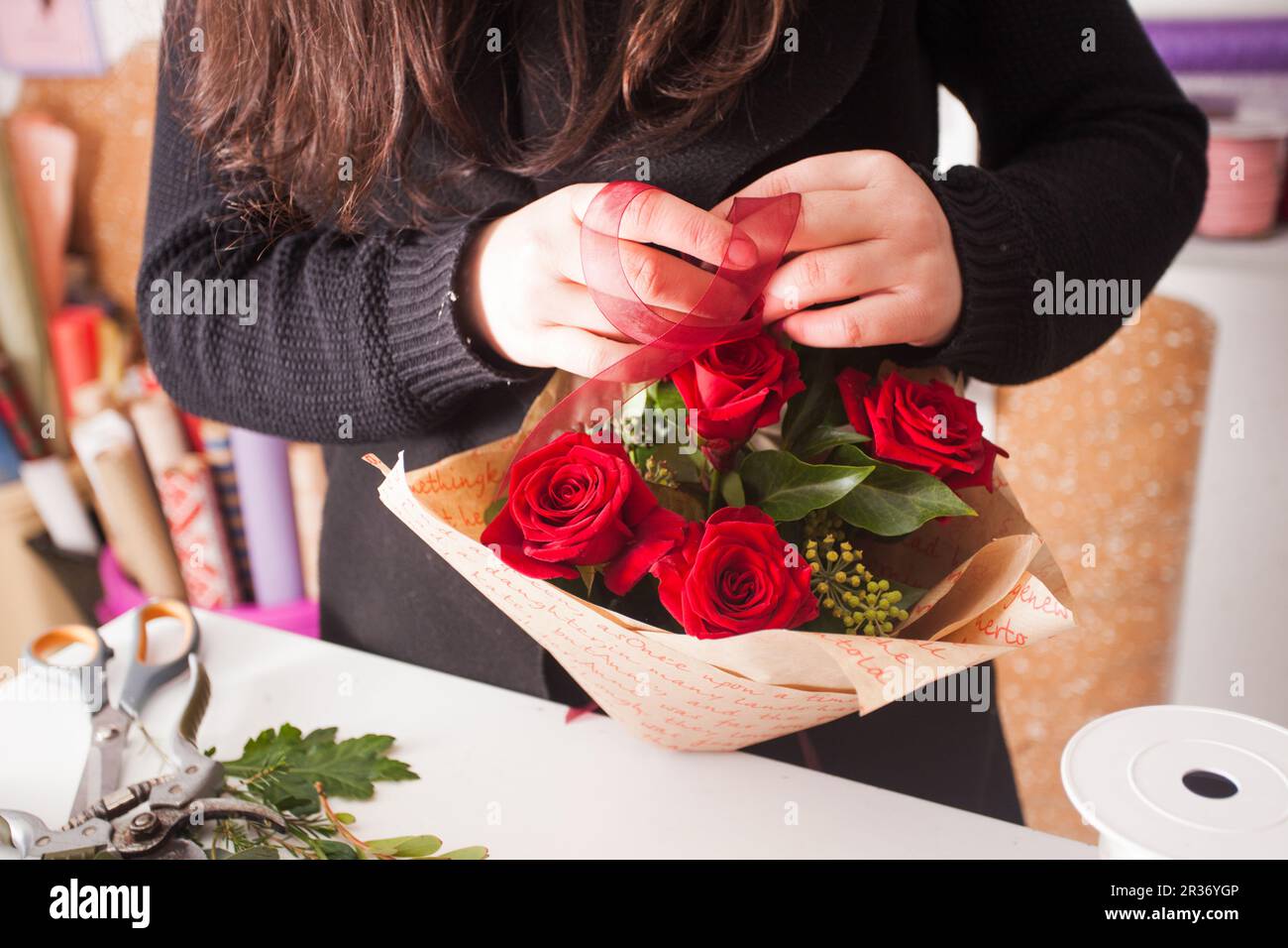Florist arranging bouquet red hi-res stock photography and images - Alamy