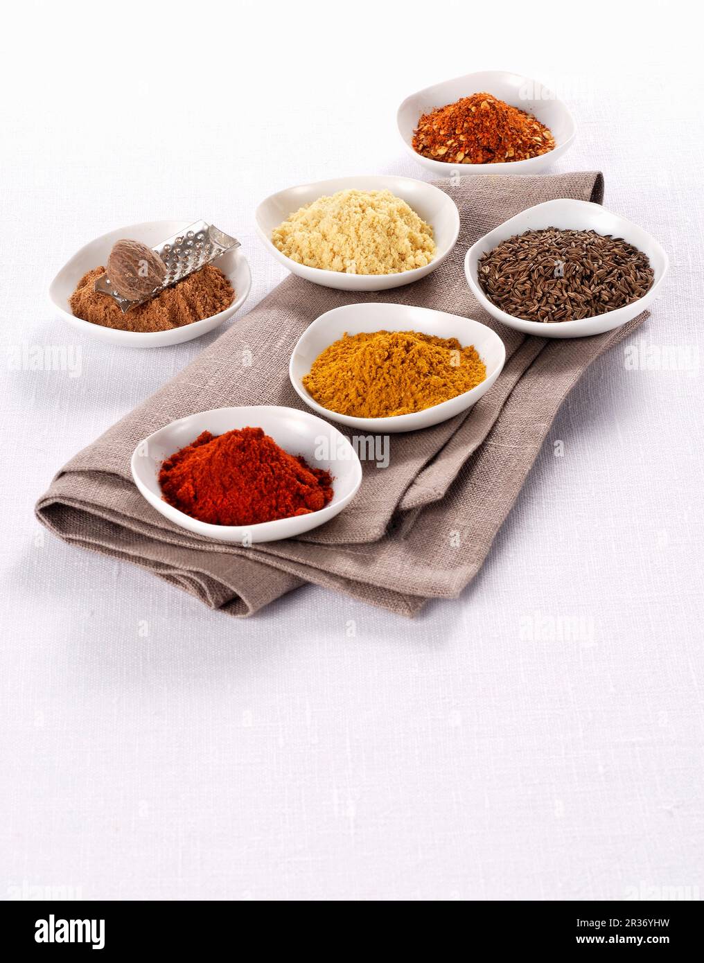 Assorted spices in small containers Stock Photo - Alamy