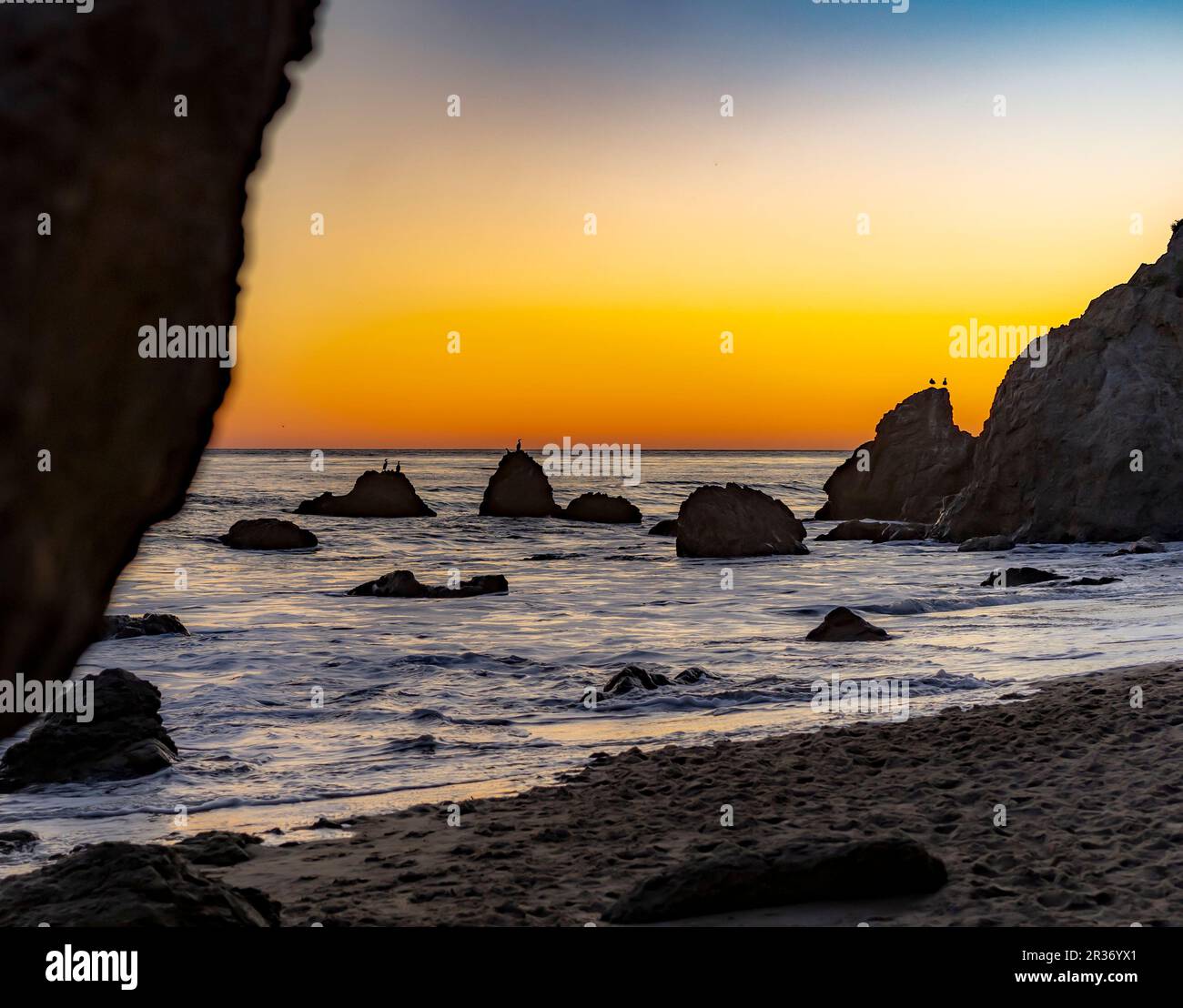 Sunset by the ocean at El Matador Beach, Malibu, California Stock Photo ...