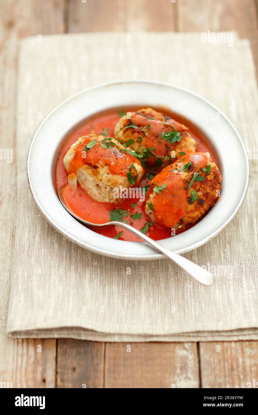 Pork meatballs with cabbage and rice in tomato sauce Stock Photo - Alamy
