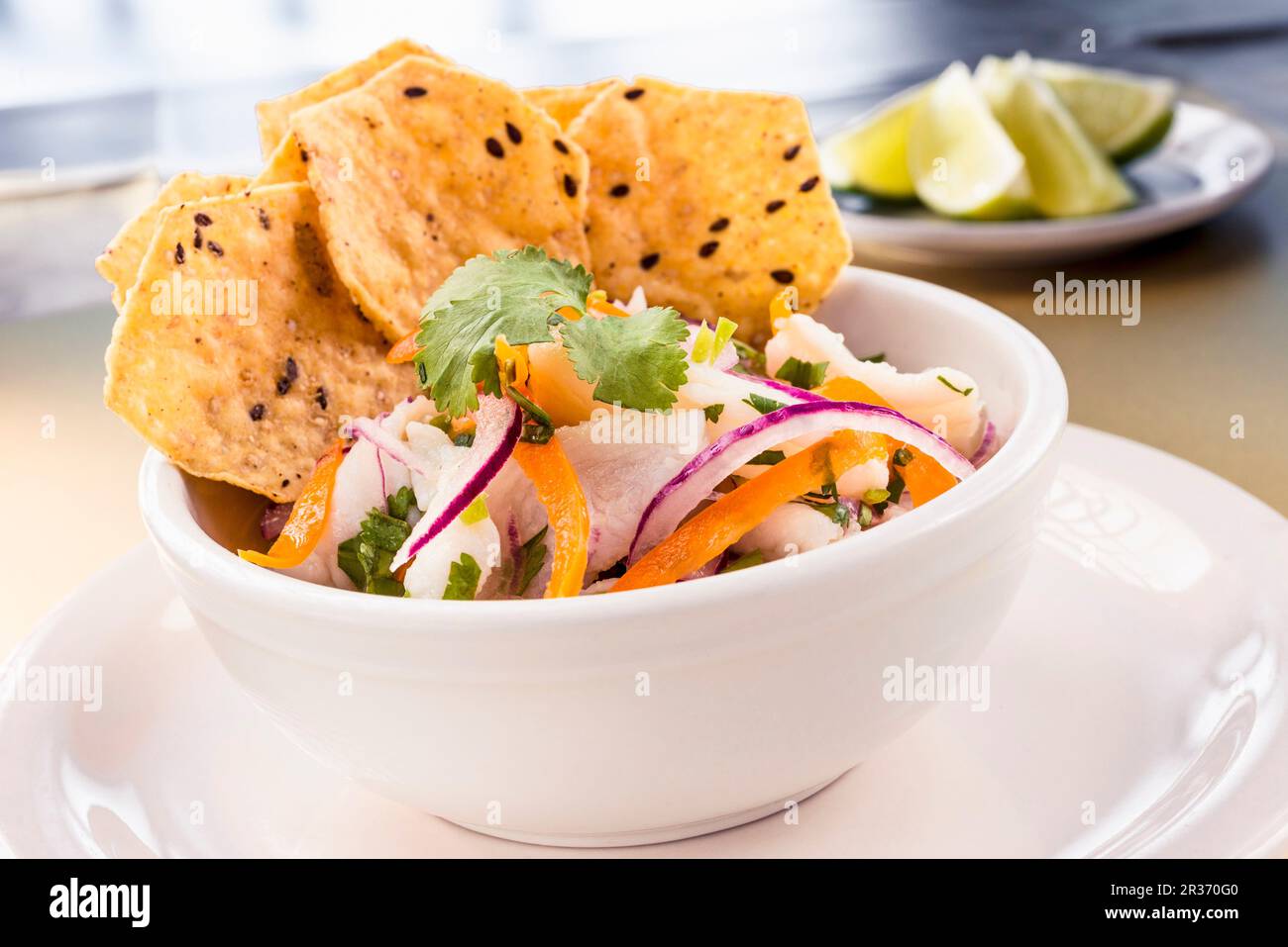Corvina fish marinated with lemon, red onions, yellow peppers and ...