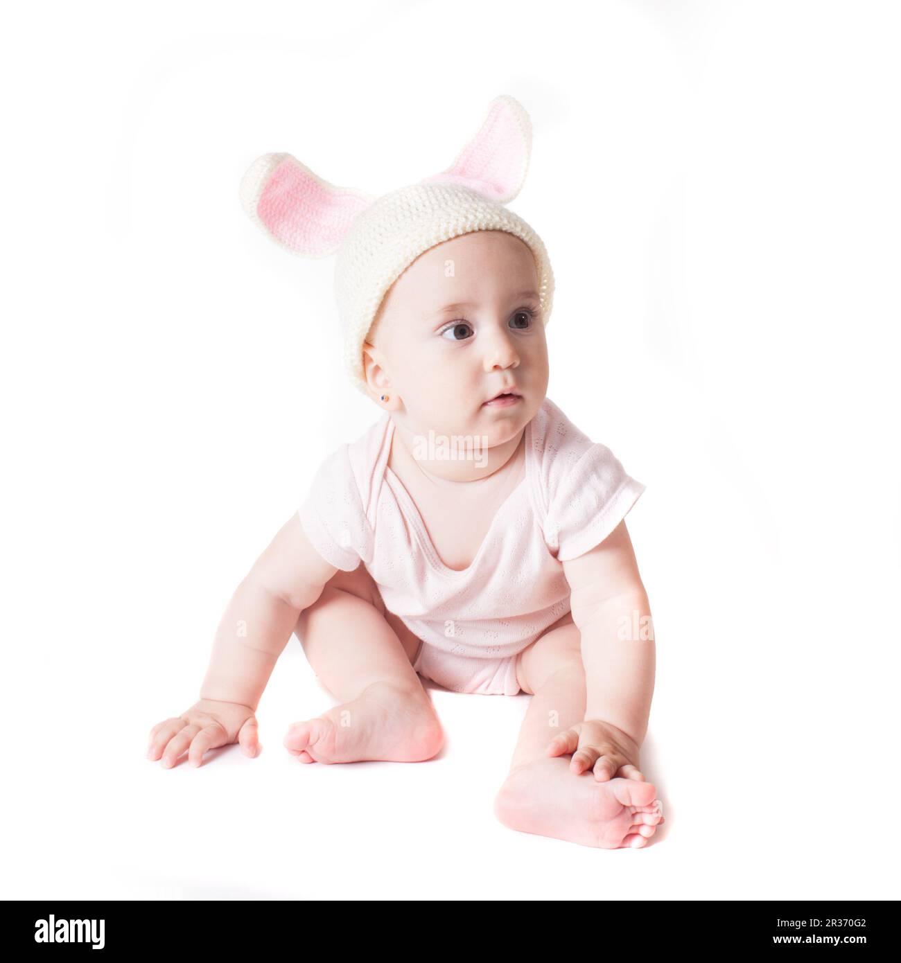 Baby girl in a rabbit hat Stock Photo - Alamy