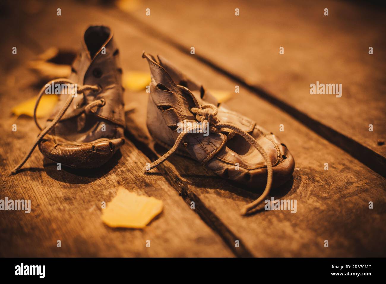 Old shoes for poor child Stock Photo - Alamy