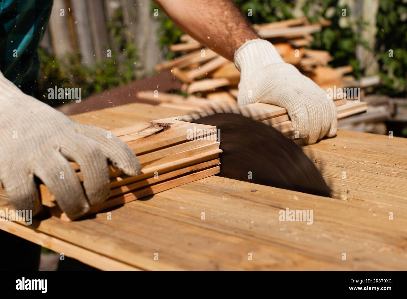 Hard work on the sawmill Stock Photo - Alamy