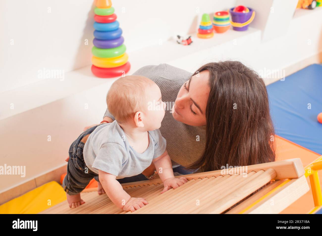 Interaction between mother and baby Stock Photo - Alamy