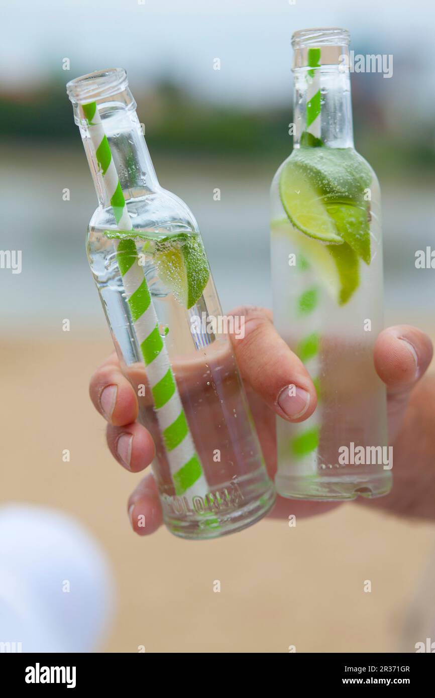 Holding out bottles hi-res stock photography and images - Alamy