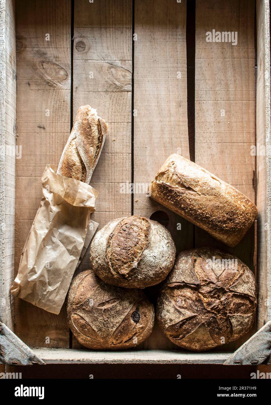 Various pieces of bread on a wooden crate Stock Photo - Alamy