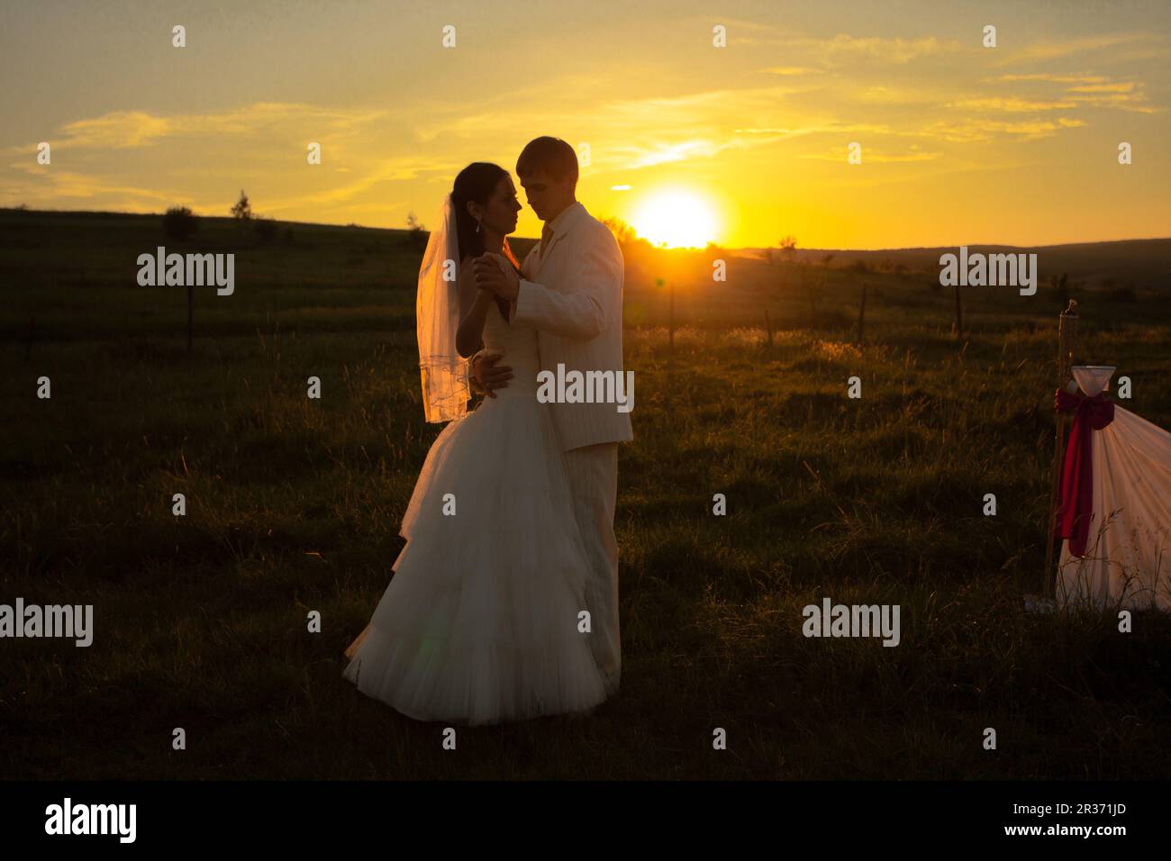 Wedding couple on sunset Stock Photo - Alamy